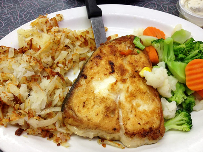 Proof that diners aren't just about breakfast—this perfectly grilled fish with colorful vegetables shows Uncle Bill's range extends well beyond eggs.