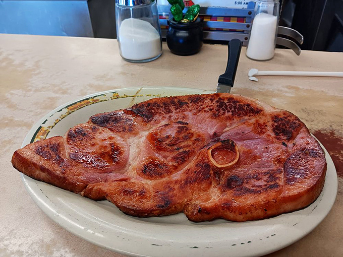 Ham steak so impressive it deserves its own ZIP code. This isn't some dainty breakfast meat—it's what lumberjacks dream about.