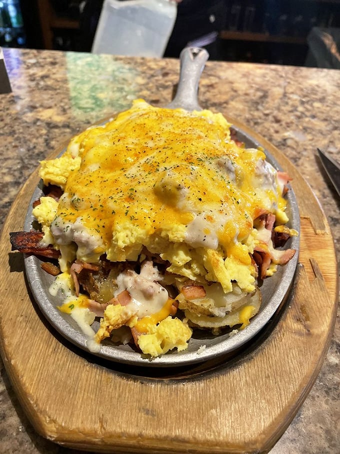 The "Hangover Skillet" – where breakfast meets therapy, piled high with eggs, potatoes, cheese, and enough protein to resurrect you from yesterday's poor decisions.