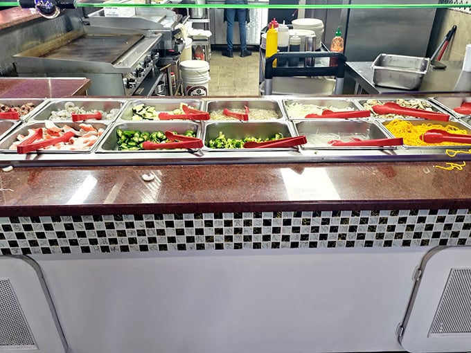 The hibachi station—where vegetables become supporting actors in your personalized protein drama.