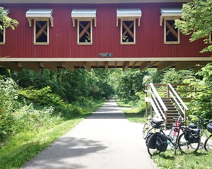 The Hyde Road Bridge doesn't just connect two sides of a trail—it connects visitors to a simpler time when red covered bridges were America's architectural calling card.