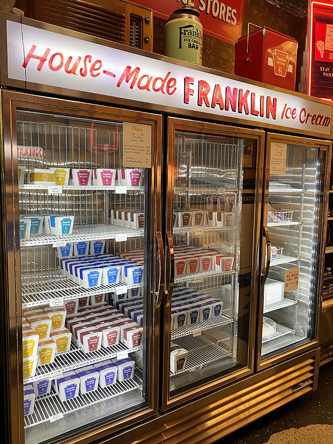 The freezer case isn't just storage—it's a gallery exhibition. Each colorful pint represents hours of churning, tasting, and perfecting.