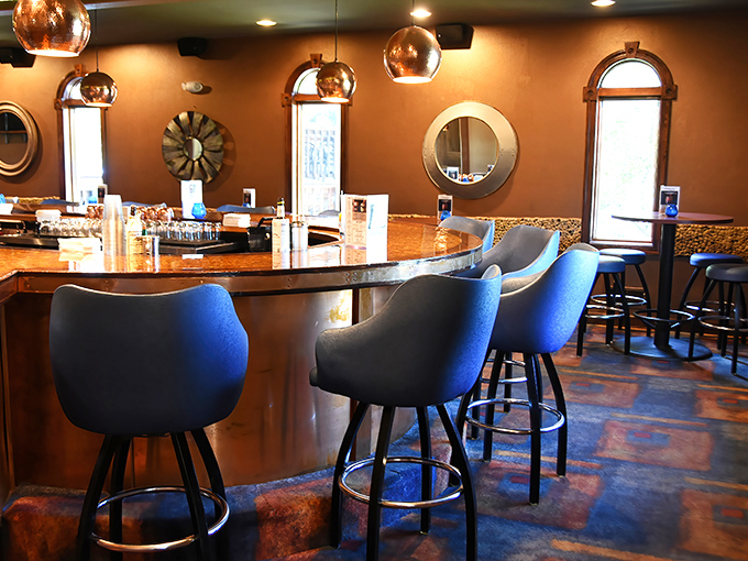 The bar isn't just where drinks are served—it's where memories begin. Copper pendant lights cast a glow that makes everyone look like they're starring in their own commercial.