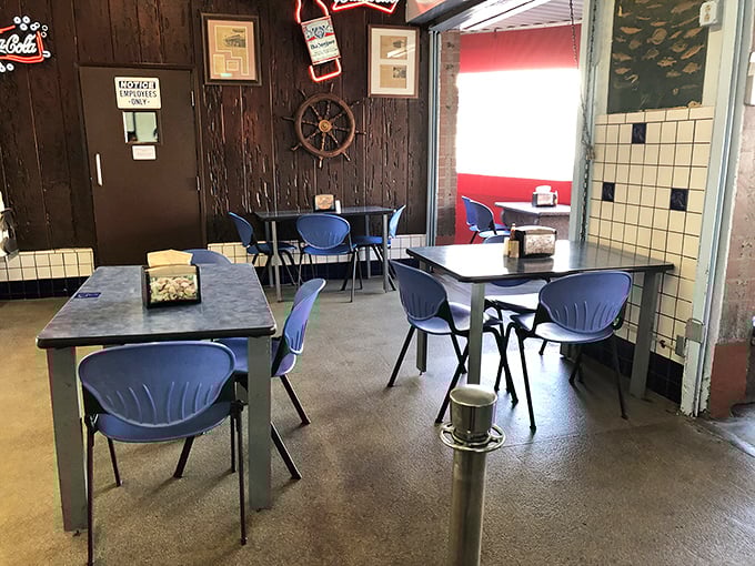 The indoor dining area keeps it simple with blue chairs and nautical touches. This isn't a place that needs mood lighting – the food creates the atmosphere.