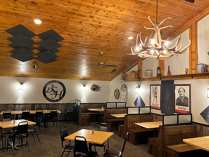 Knotty pine ceilings, antler chandeliers, and wooden booths—this isn't decoration, it's steakhouse DNA. Pure Michigan comfort.