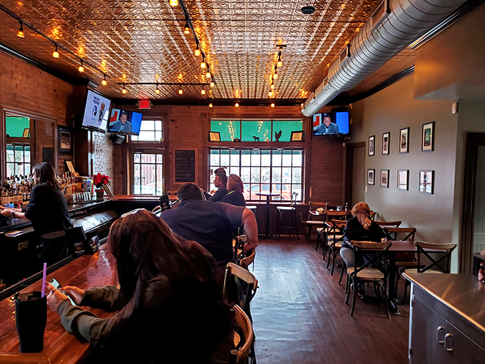 Pressed tin ceilings, exposed brick, and golden lighting create the perfect backdrop for culinary memories. Comfort never looked so sophisticated.