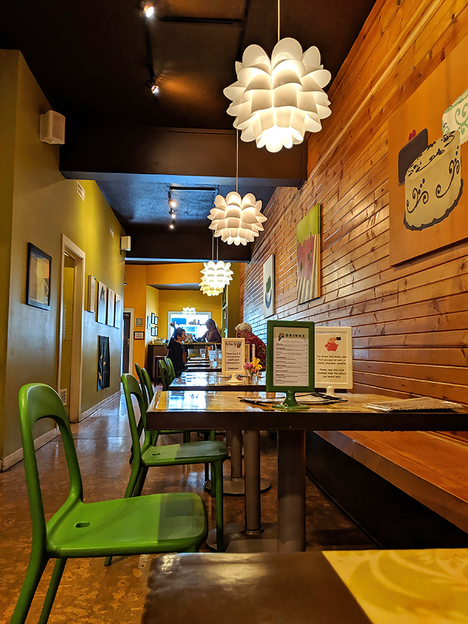 Lotus-like pendant lights float above wooden benches, creating an atmosphere that's equal parts Scandinavian chic and Wisconsin cozy.