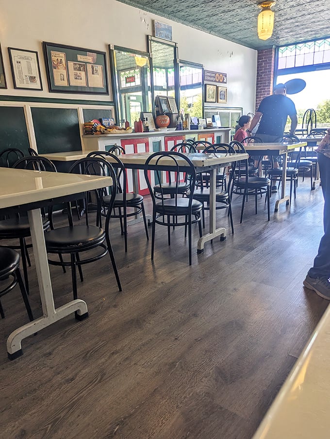Simple tables, classic chairs, and sandwich perfection. This dining room isn't about the frills—it's about creating the stage for your taste buds' standing ovation.