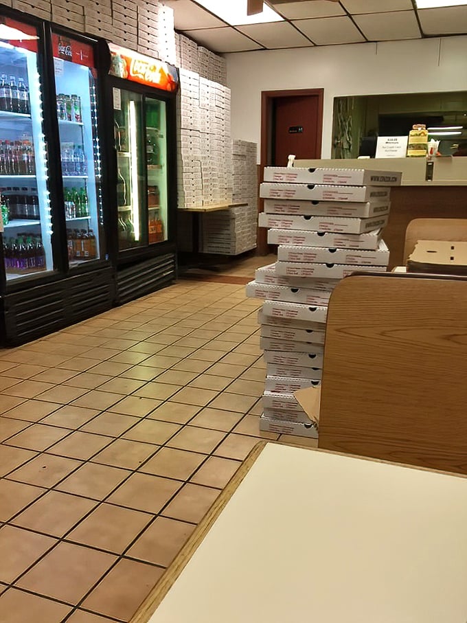 Behind the scenes where pizza magic happens. Those stacked boxes represent dozens of future happy meals.