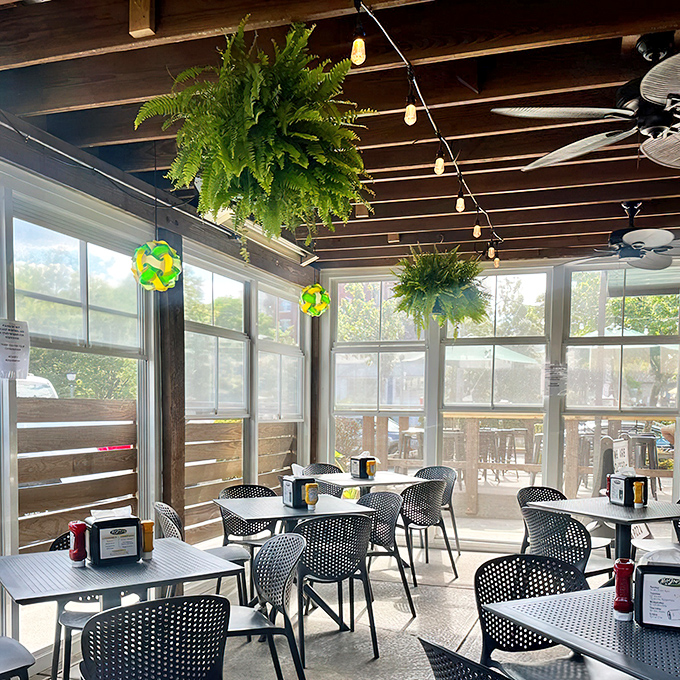 The bar area hums with conversation and anticipation. Those ceiling fans aren't just for show—they're wafting burger aromas throughout the joint.