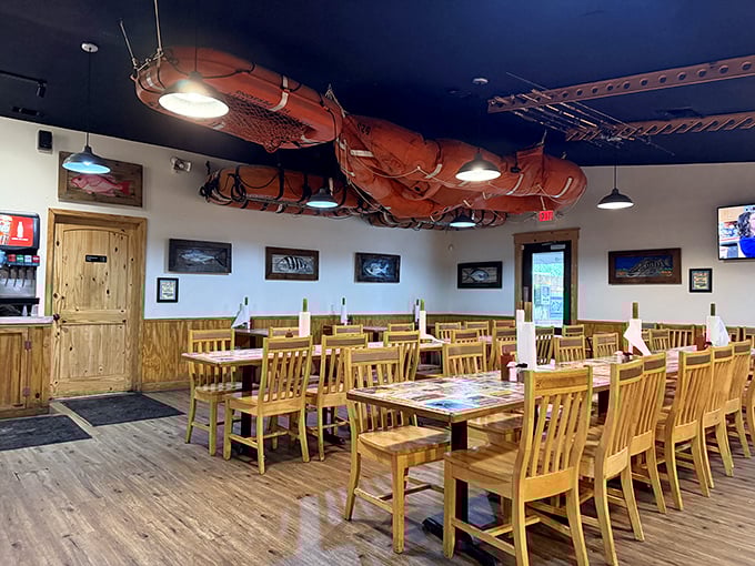 Fishing nets suspended from the ceiling – because nothing says "your seafood was swimming this morning" quite like nautical décor that means business.