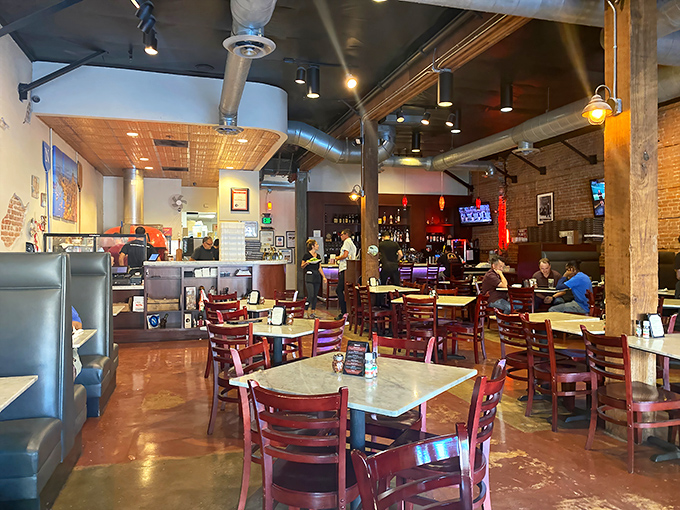 The dining room hums with anticipation and satisfaction. Every table holds the promise of an impending pizza miracle.
