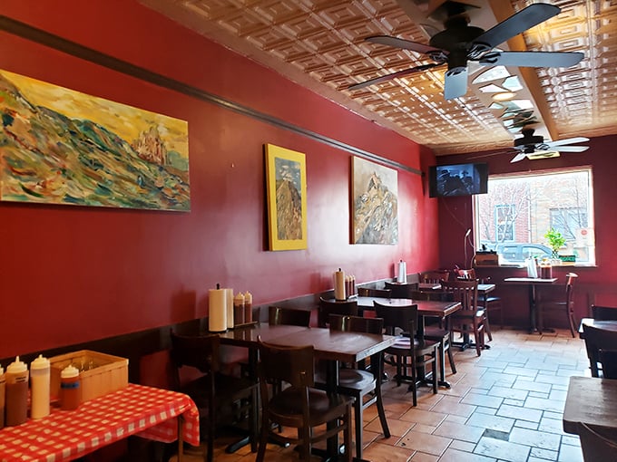 The pressed tin ceiling and simple furnishings create a dining room where the only distraction from your meal is other people's food.