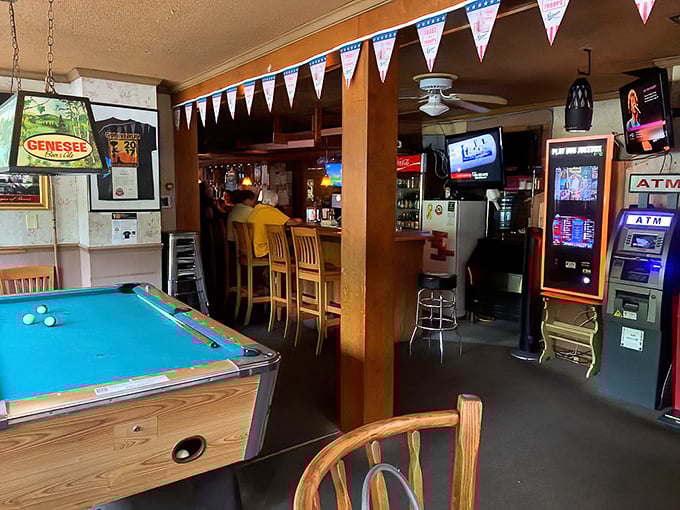 The pool table and bar area create that classic tavern trifecta: cold drinks, good games, and the promise of wings just a few steps away.