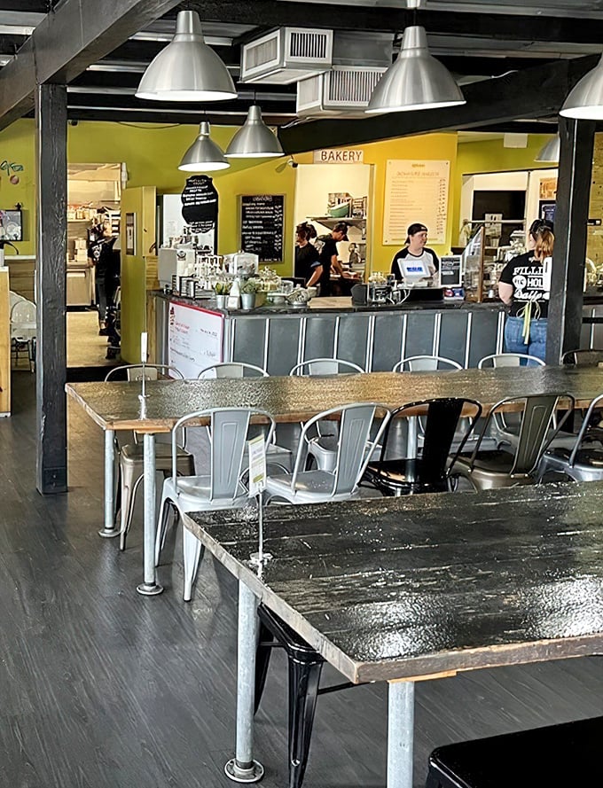 The bustling heart of Se7enBites, where industrial elements and warm wood create a space that feels both modern and comfortingly familiar.