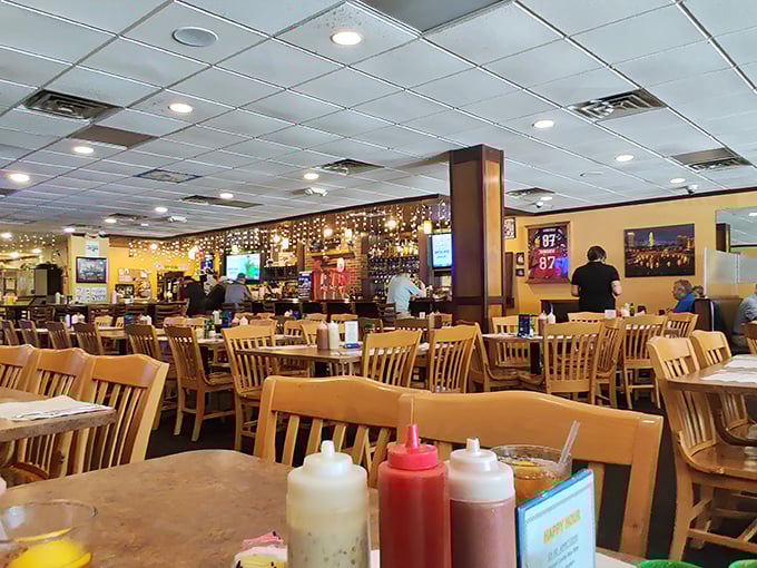 The dining room buzzes with anticipation as wooden chairs cradle seafood seekers. Notice the condiment bottles—essential tools for the journey ahead.