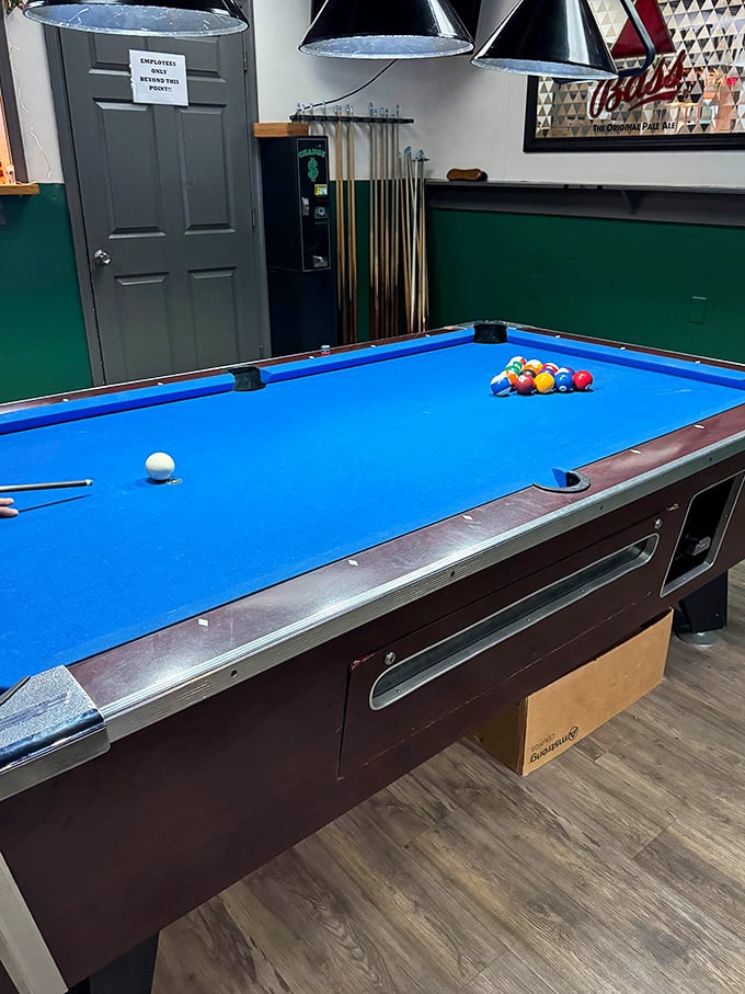 The pool room's green walls aren't trying to be trendy—they've been this color since before trendy was a thing.