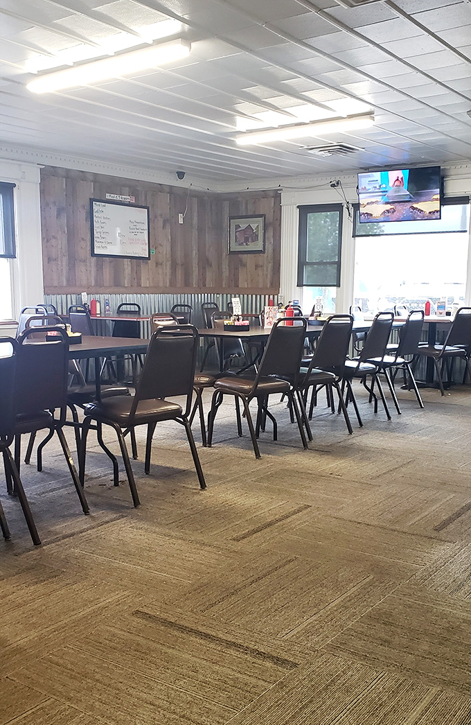 Empty tables waiting for hungry diners—a rare sight in this local favorite where the wood-paneled walls have heard decades of community stories.