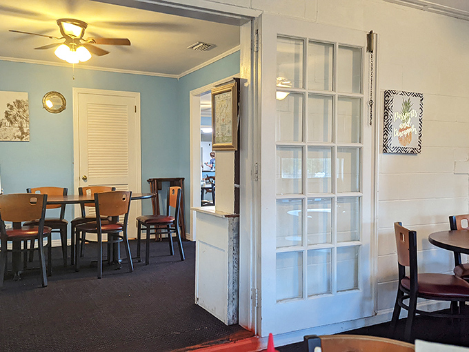 Different room, same philosophy: blue walls, simple tables, and a space that feels more like dining at a friend's house than a restaurant.