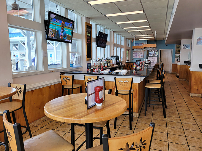 The bar area invites lingering conversations and impromptu friendships – where strangers become dining companions over shared appetizers.