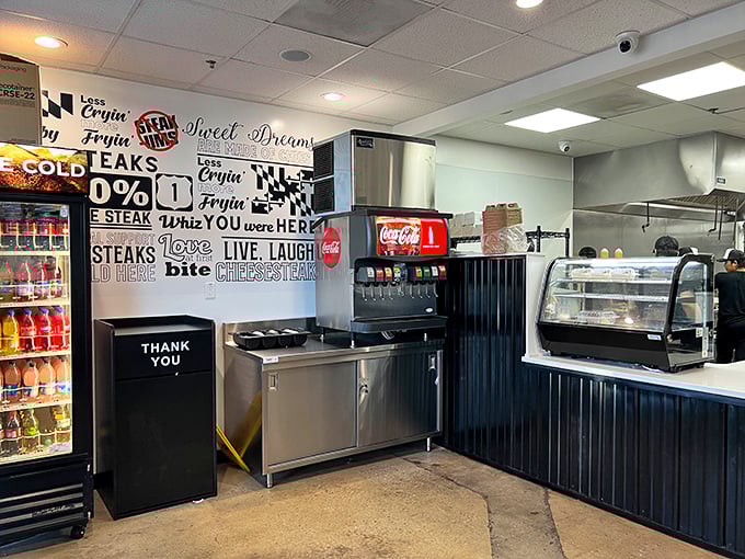 Modern minimalism meets sandwich artistry – black corrugated panels and motivational wall art create the perfect cheesesteak backdrop.