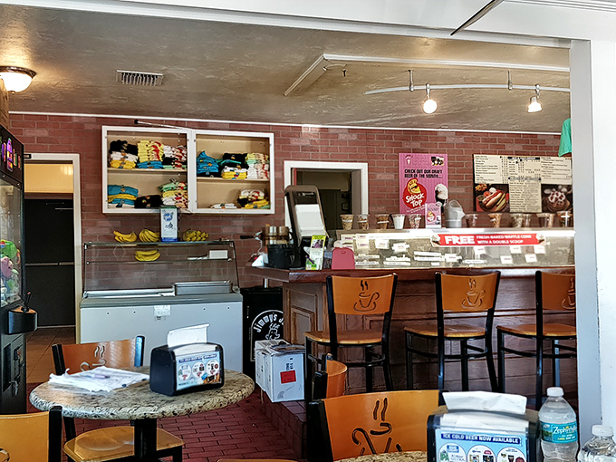 The counter seating offers front-row tickets to the ice cream show, where scooping is elevated to performance art.