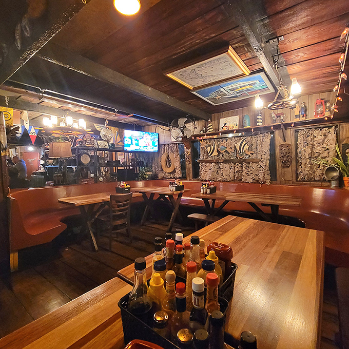 Wooden beams, nautical treasures, and cozy booths create the perfect maritime hideaway. No designer needed—just decades of authentic harbor life.