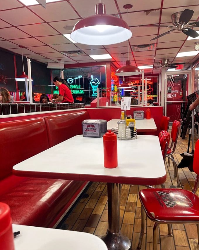 Every booth promises its own little universe of comfort, complete with a view of culinary theater.