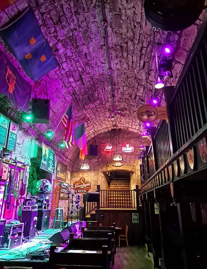 The stage is set for memories to be made. Purple and green lights transform ancient stone into a magical music venue.