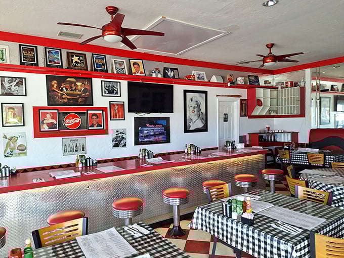 Red ceiling fans spinning lazily above checkered floors – it's like Happy Days met a really good breakfast spot.