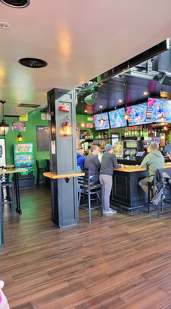 The bar buzzes with local energy where sports debates flow as freely as the perfectly poured beer taps.