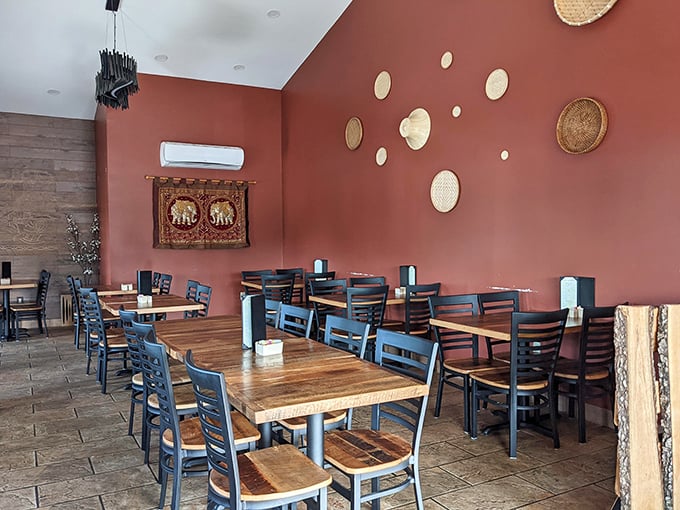 The terracotta walls adorned with handcrafted baskets create a dining room that feels both exotic and homey—like visiting a friend's place in Chiang Mai.