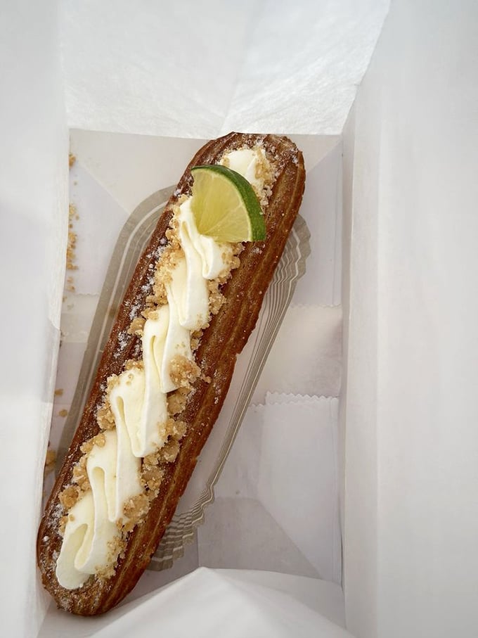 Key lime éclair looking like a tiny green torpedo of happiness – Florida vacation in pastry form.