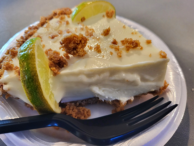 Key lime pie that strikes the perfect balance between sweet and tart—just like the best conversations at the Raw Bar's communal tables.