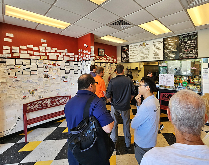 The lunchtime pilgrimage to cheesesteak nirvana – these folks know that good things come to those who wait, especially when it's this good.