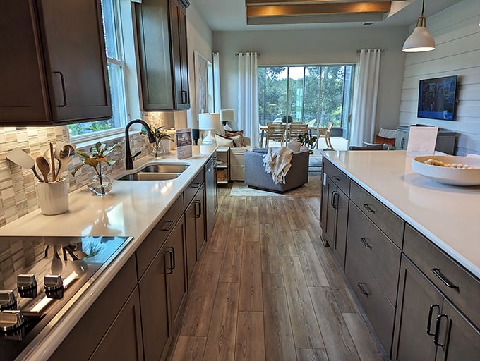 Modern kitchen dreams come true – where open concept meets warm wood tones, and every meal prep feels like you're on a cooking show.