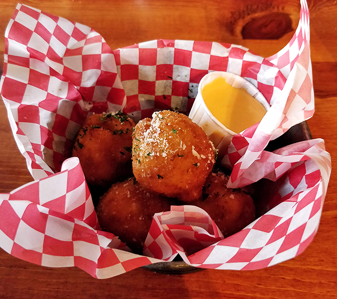 Mac and cheese that grew up, went to college, and came back cooler than ever—fried into bite-sized spheres of molten goodness.