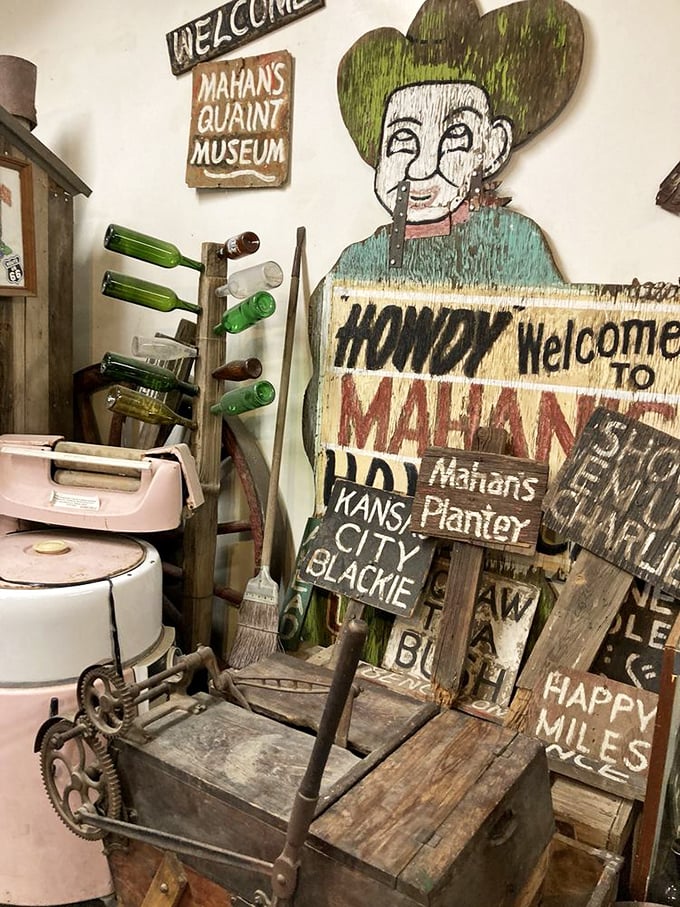 Mahan's exhibit captures the quirky roadside attractions that once dotted Route 66—where else could you find a cowboy cutout next to vintage washing machine parts?