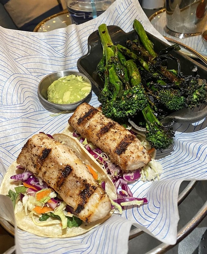 Fish tacos and charred broccoli—proof that sometimes the simplest preparations let perfect ingredients speak their delicious truth without unnecessary complications.