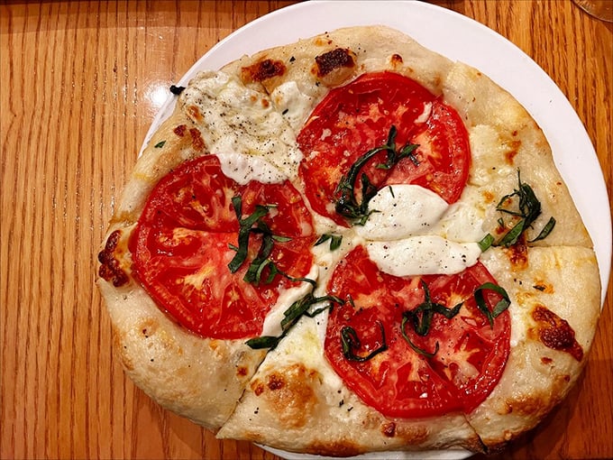 Pizza perfection in its simplest form – where tomatoes and fresh basil remind you why the classics never go out of style.