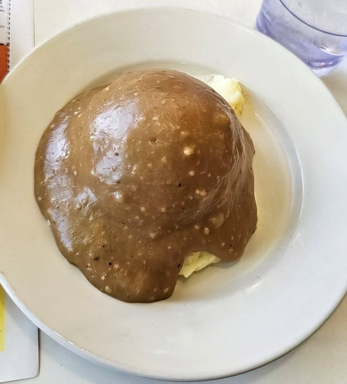Mashed potatoes and gravy—comfort food so sincere it feels like a warm hug from your grandmother, if your grandmother was a culinary genius.