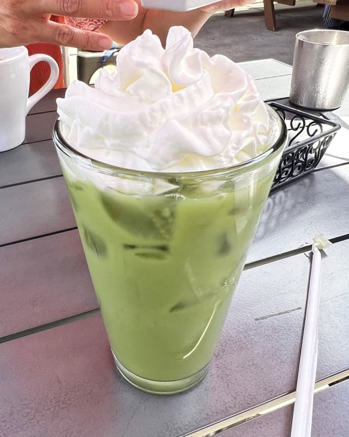 This matcha melon tea topped with clouds of whipped cream isn't just a drink – it's what summer would look like if it took liquid form.