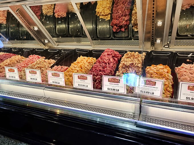 The deli case—where dreams are stored at proper temperature. A rainbow of protein possibilities awaits the hungry and decisive.