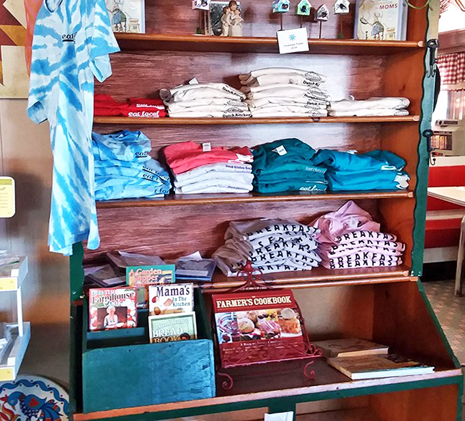 The gift shop corner—where Pennsylvania Dutch cookbooks and tie-dye t-shirts somehow make perfect sense together.