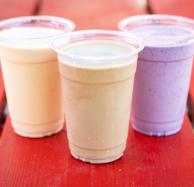 Three milkshakes in a row—vanilla, caramel, and berry—looking like the lineup of finalists in America's Next Top Dessert.