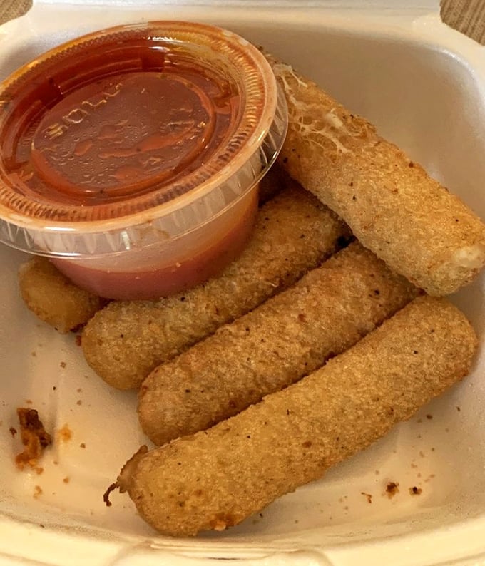 Golden-brown, perfectly crisp mozzarella sticks—the universal language of appetizer love. That marinara sauce is ready for its dipping destiny.