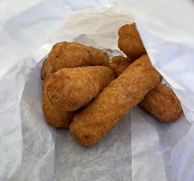 Golden-fried mozzarella sticks: the supporting actors that sometimes steal the scene. Crispy exterior, molten interior—a textbook example of fried perfection.