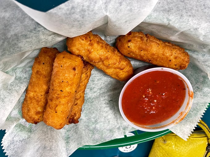 Golden-fried mozzarella sticks with marinara—the perfect opening act before the main event. Crispy outside, stretchy inside, happiness all around.