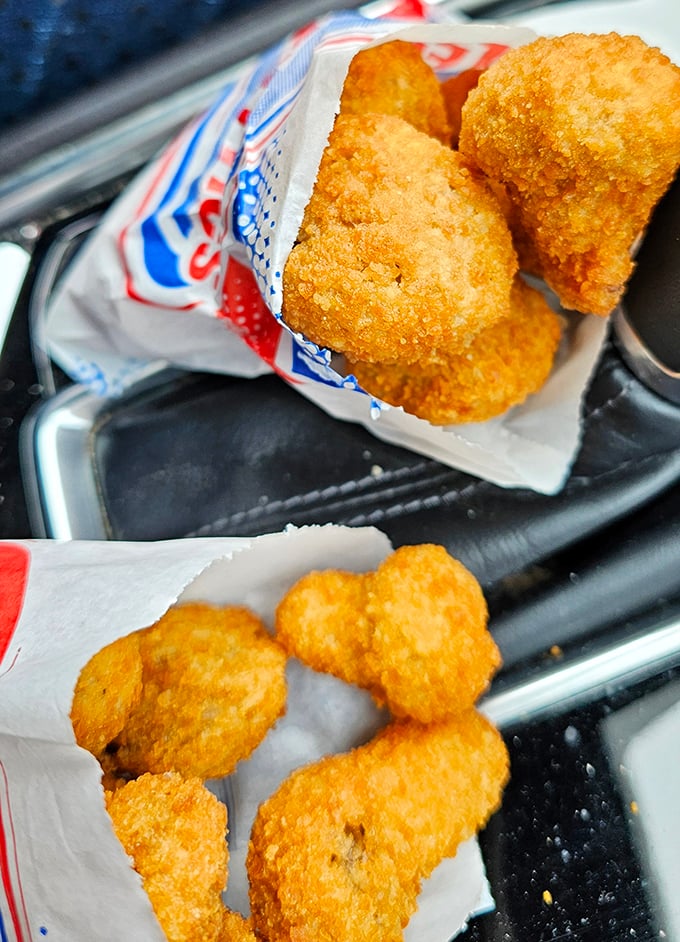 These aren't your fancy restaurant mushrooms – these are honest-to-goodness golden nuggets of joy that crunch like childhood memories.