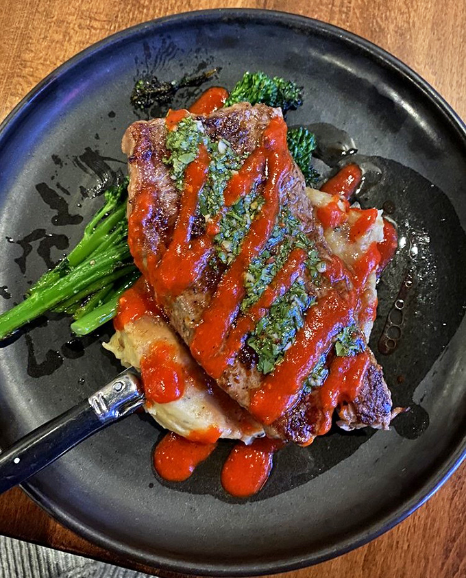 A steak that's clearly been introduced to fire and fell madly in love. The vibrant sauce and tender broccolini prove that three's definitely not a crowd on this plate.